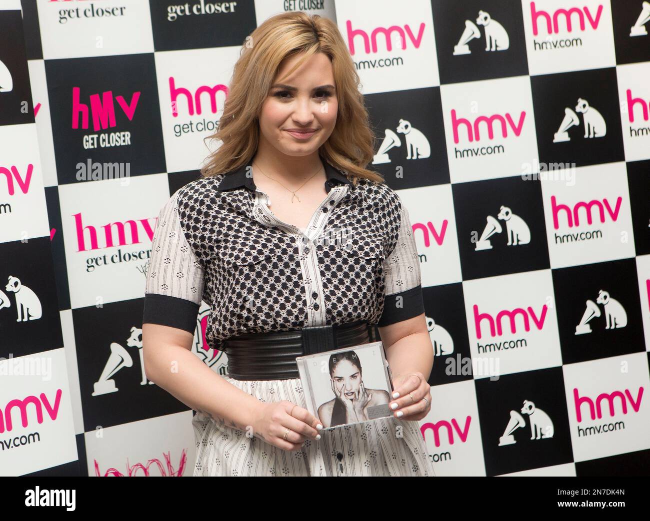 Demi Levato arrives at a HMV store in Oxford Street, central London ...