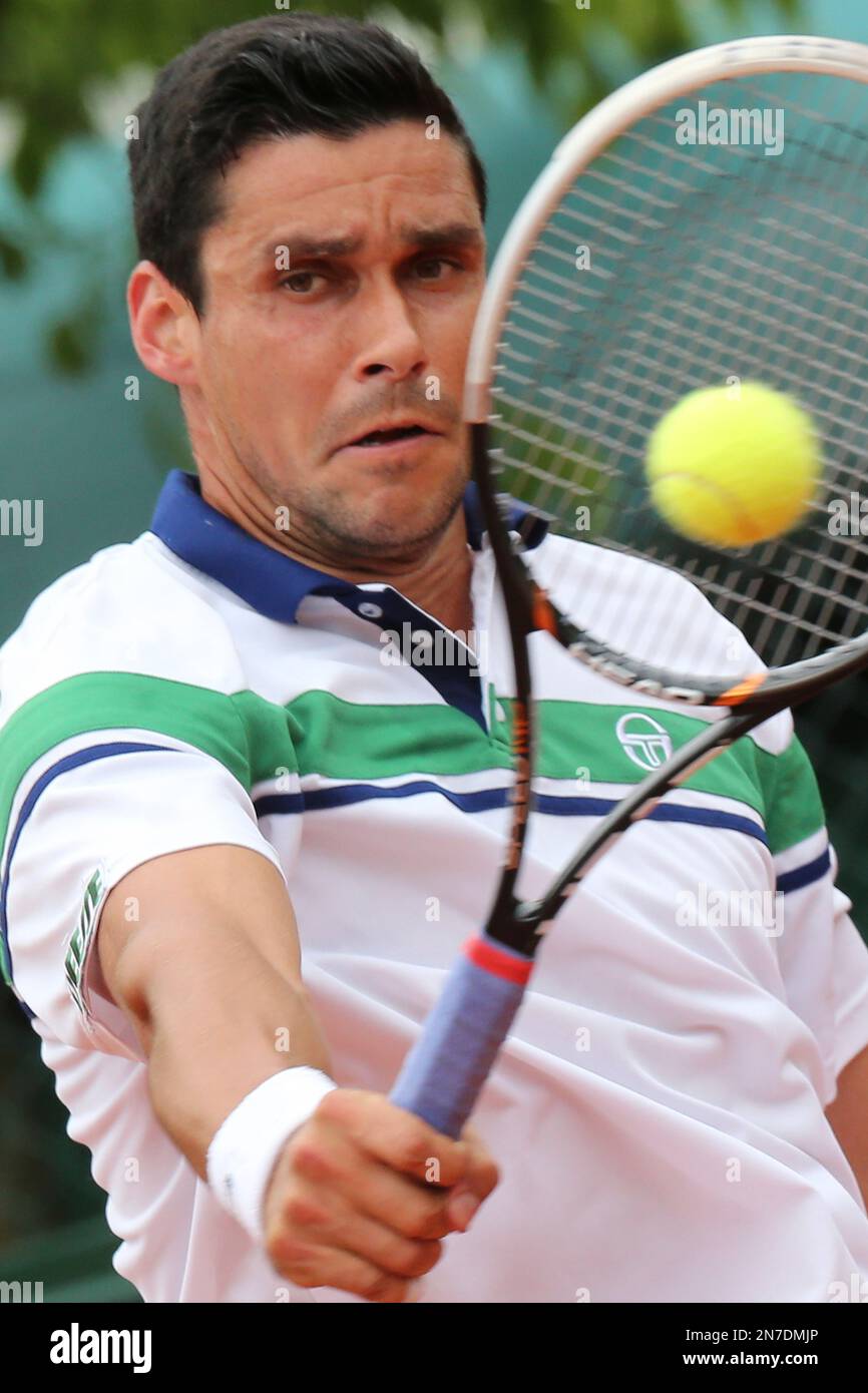 CAPTION CORRECTS NAME OF PLAYER Romania's Victor Hanescu returns the ...