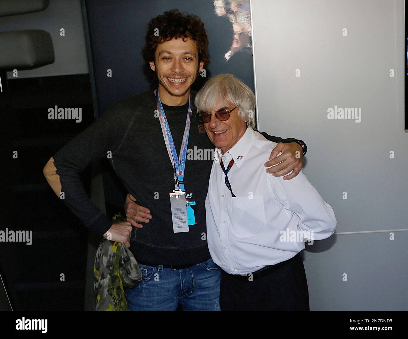 Italian rider Valentino Rossi hugs Bernie Ecclestone during the Formula ...