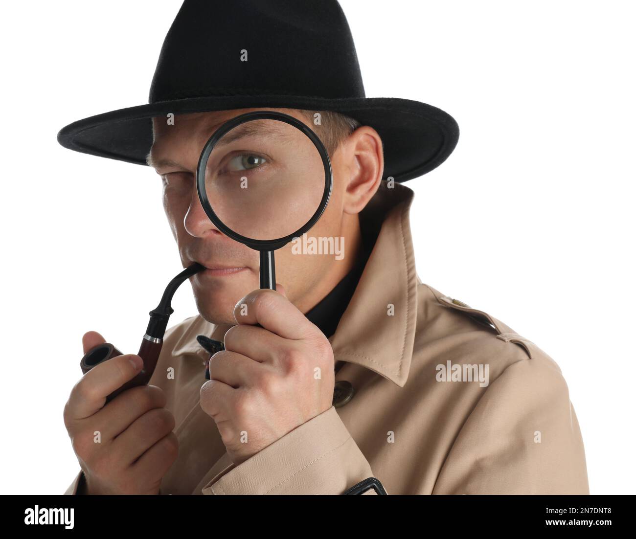 Male detective with smoking pipe looking through magnifying glass on ...