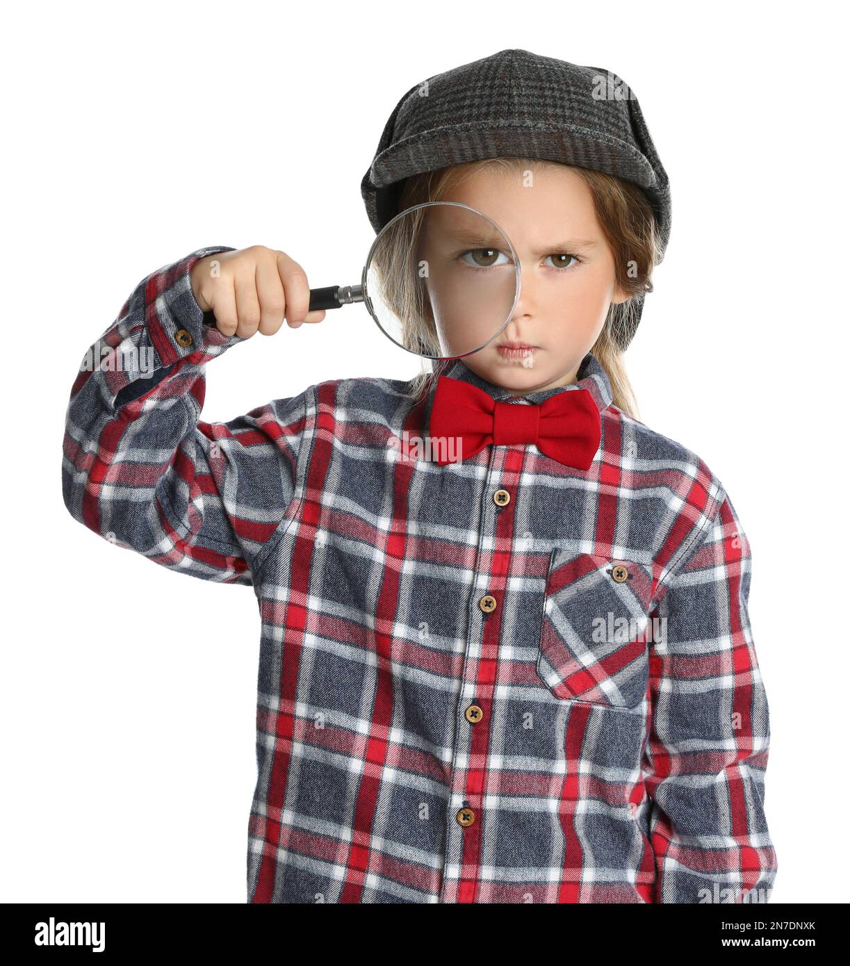 Cute little child in hat with magnifying glass playing detective on ...