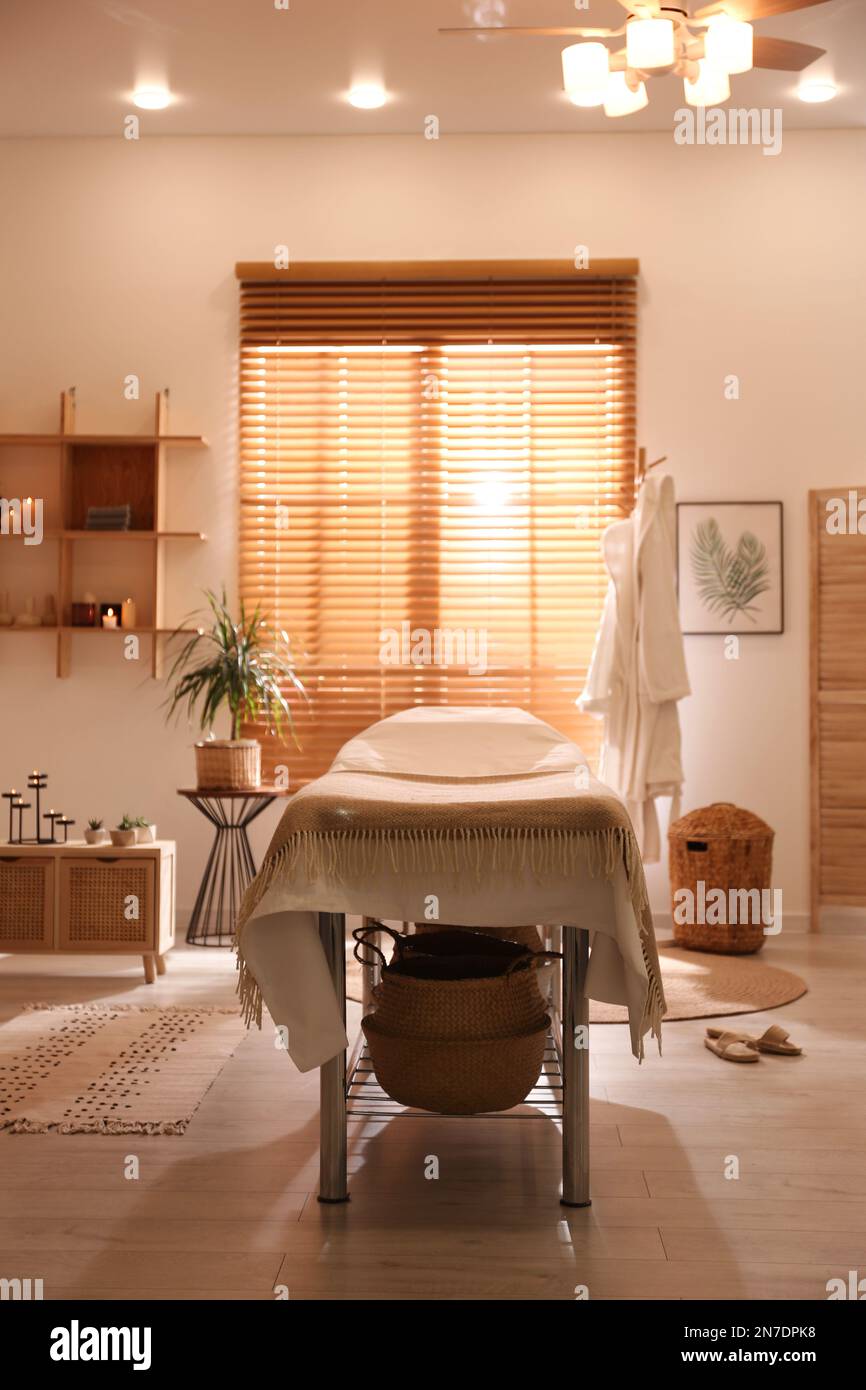 Stylish massage room interior in spa salon Stock Photo - Alamy