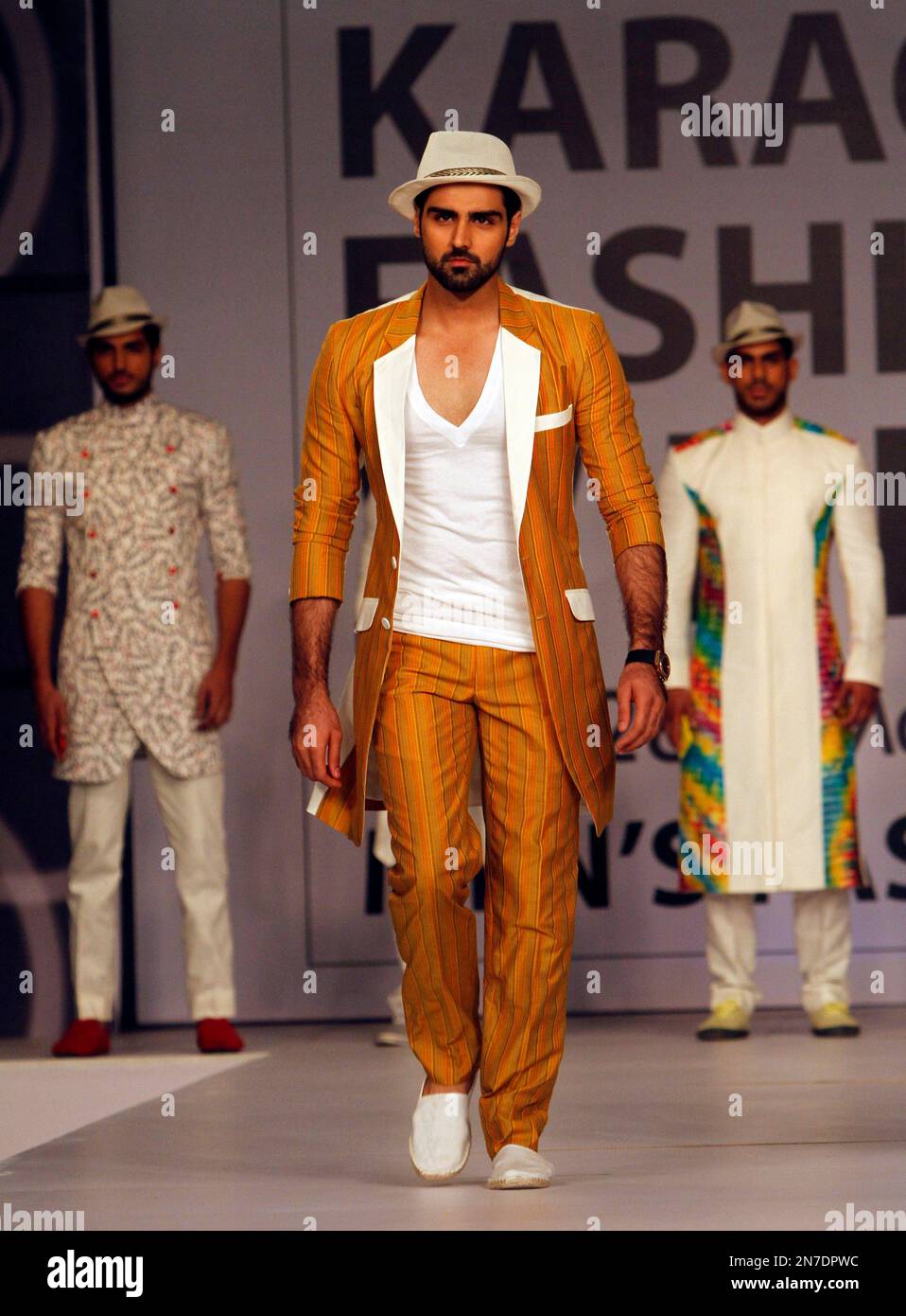 Pakistani models present creations by designer M. Yahseer, during Men's ...