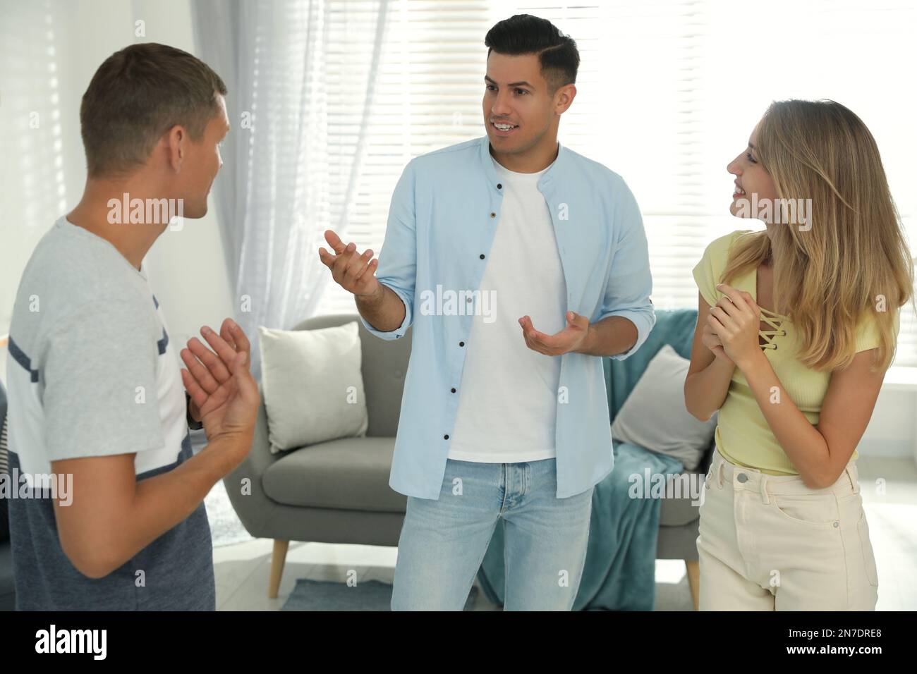 Group talking happy gesture hi-res stock photography and images - Alamy