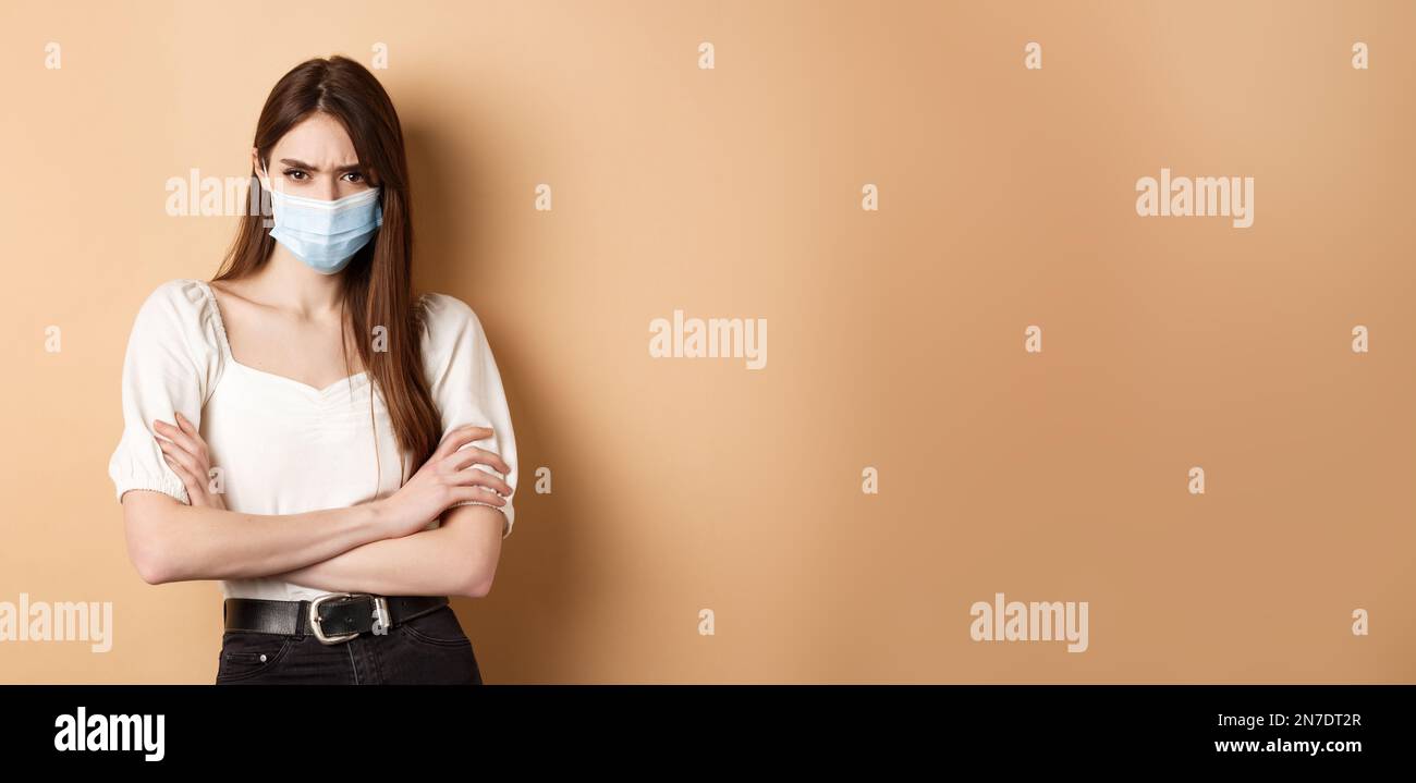 Covid-19 and lifestyle concept. Angry woman look with despise, wearing ...