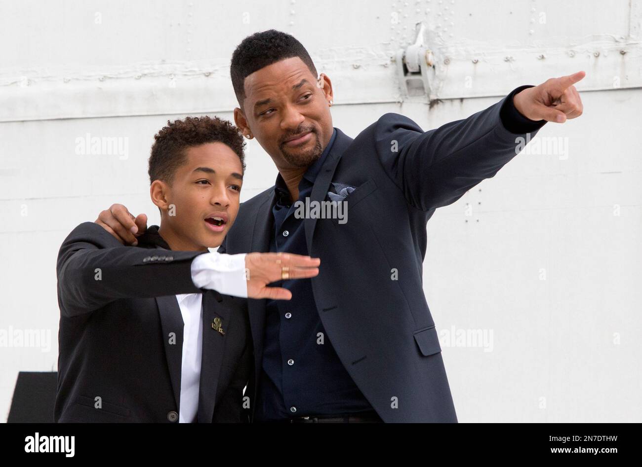 Film star Will Smith, right, and his son Jaden Smith stand on a wing of ...