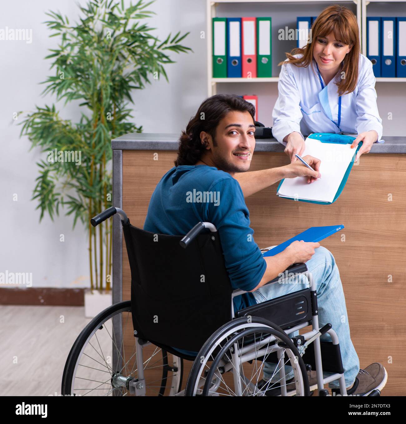 The young patient at the reception in the hospital Stock Photo - Alamy