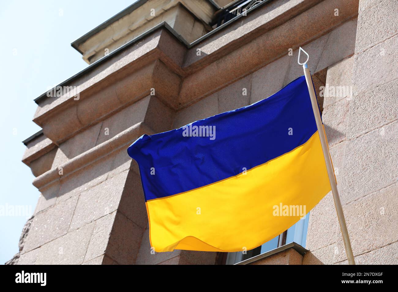 Flags of Ukraine and Mykolaiv on building facade Stock Photo - Alamy