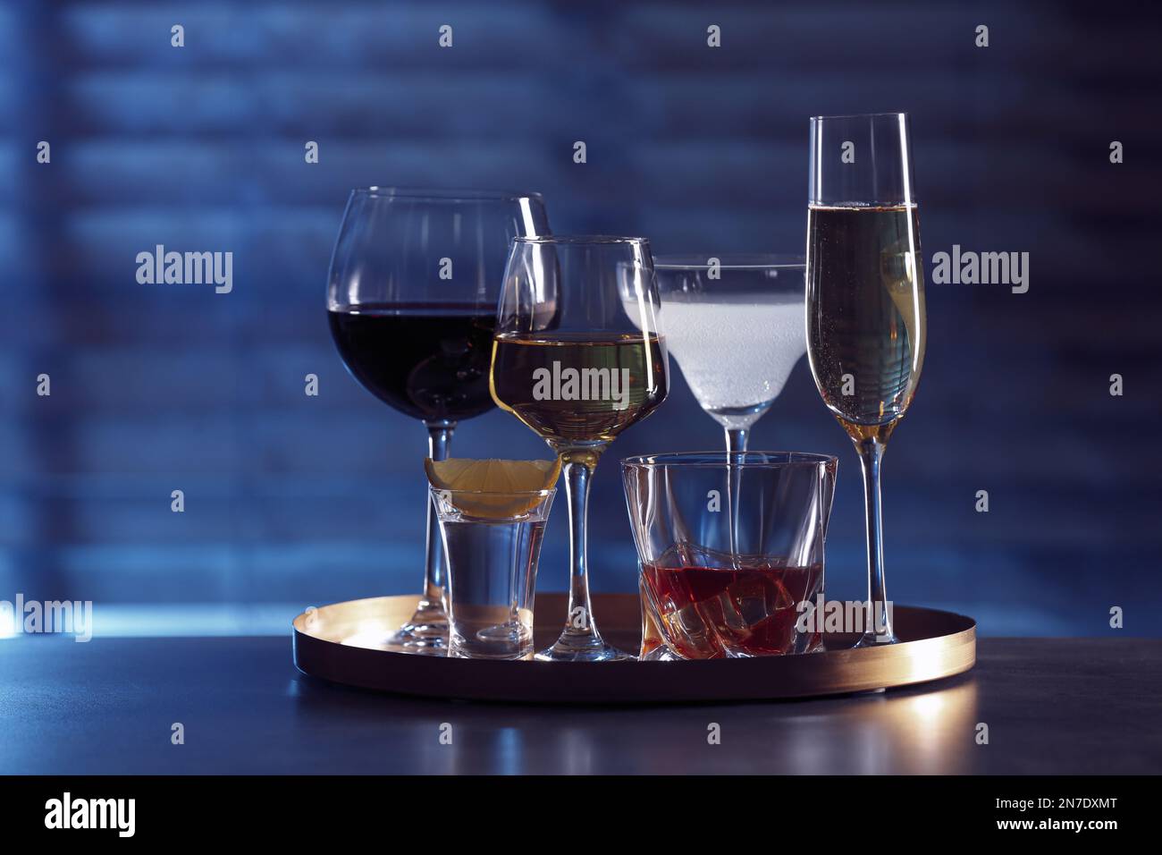 Tray with different alcohol drinks on table indoors Stock Photo - Alamy