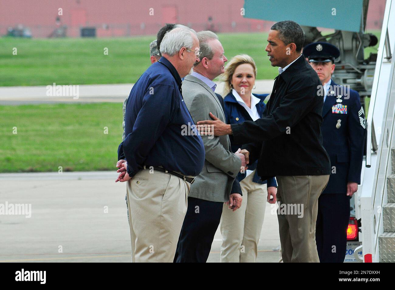 President Barack Obama shakes hands with Oklahoma City Mayor Mick ...