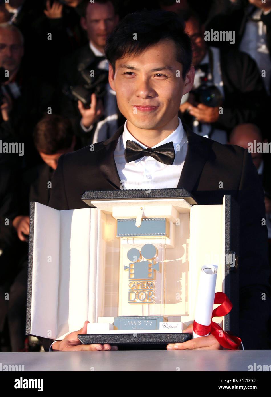 Director Anthony Chen poses with the Camera d'Or award for his film Ilo ...