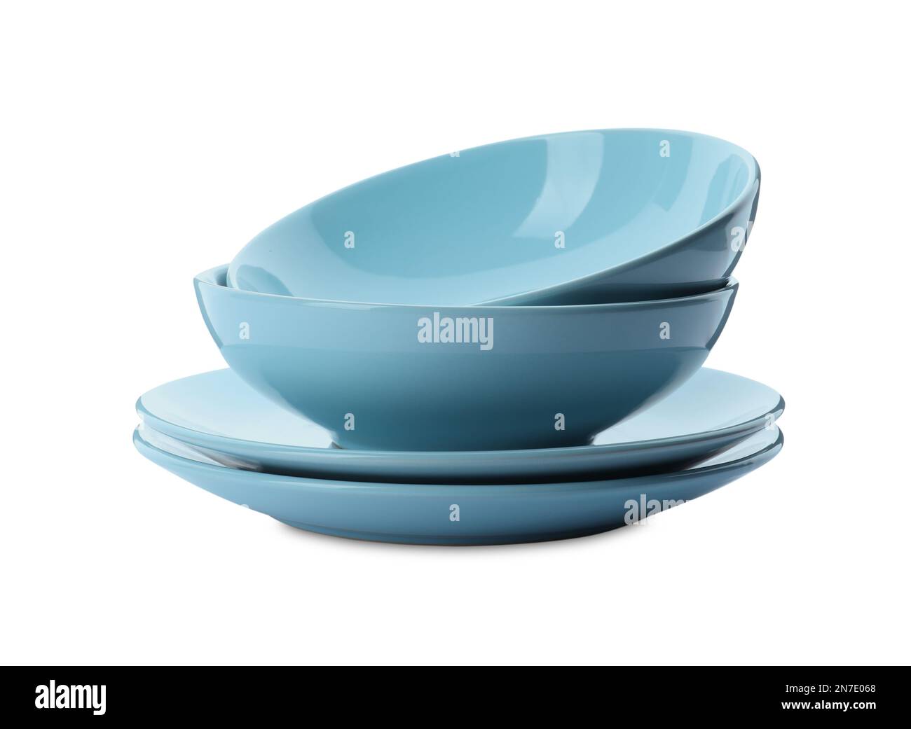 Stack of clean plates and bowls on white background Stock Photo - Alamy