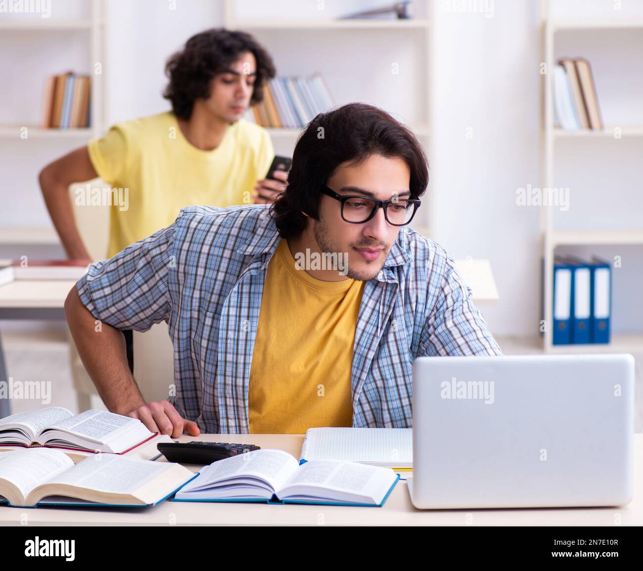 The two male students in the classroom Stock Photo - Alamy