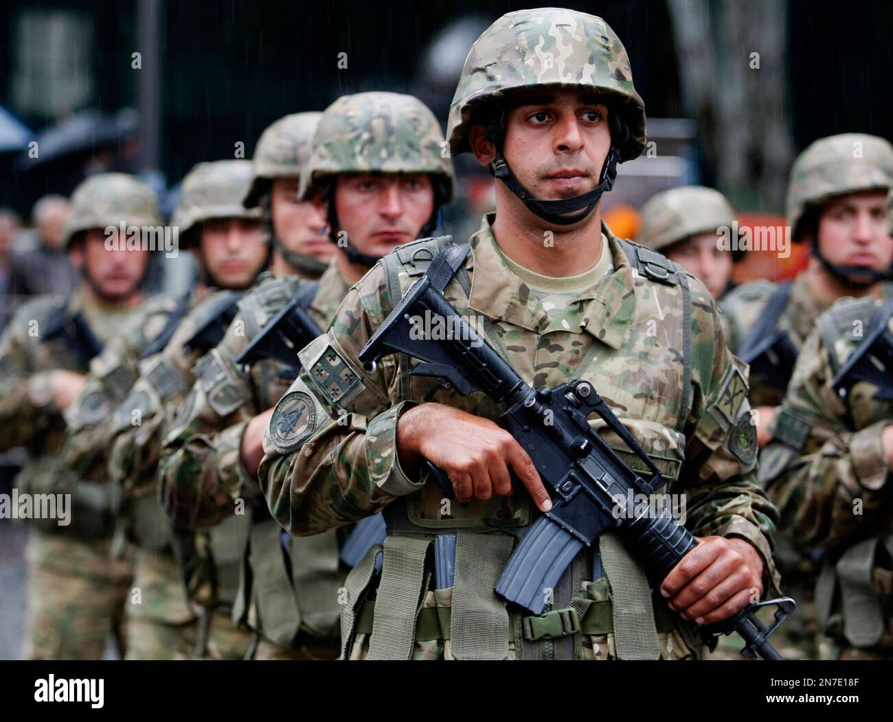 Georgian soldiers stand in line as they mark an Independence Day in ...