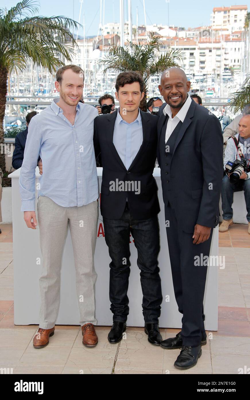 From left, actors Conrad Kemp, Orlando Bloom, and Forest Whitaker pose ...