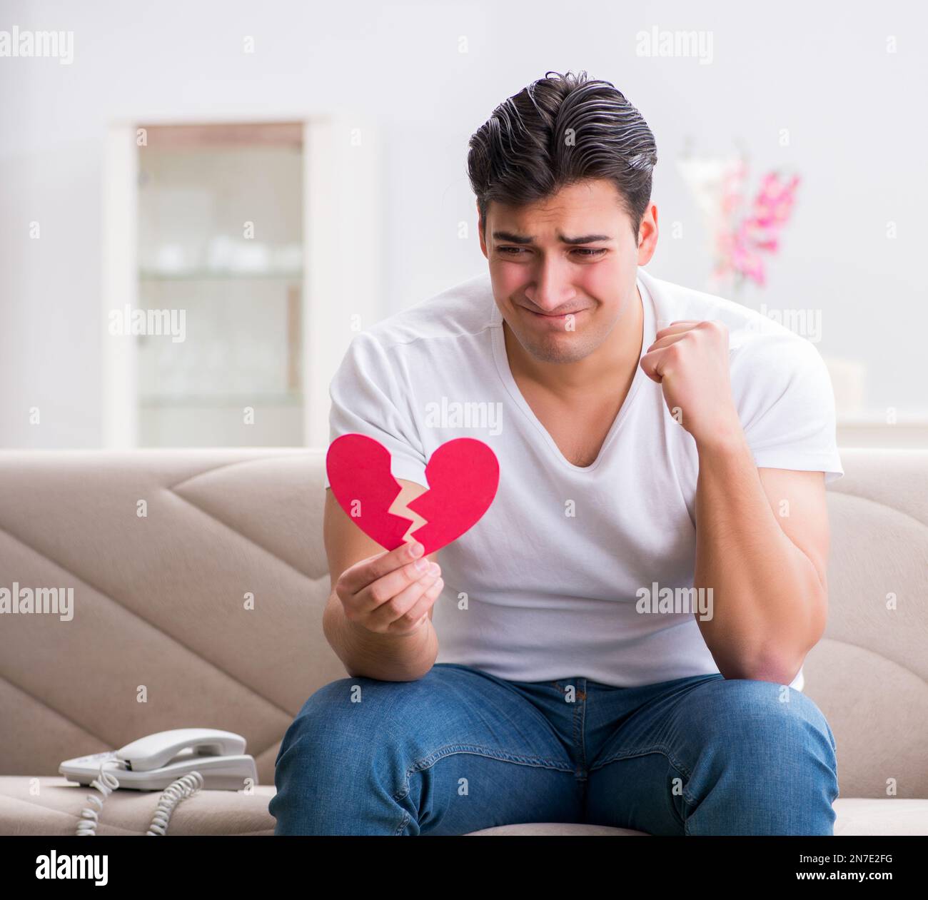 The young man in sad saint valentine concept Stock Photo - Alamy