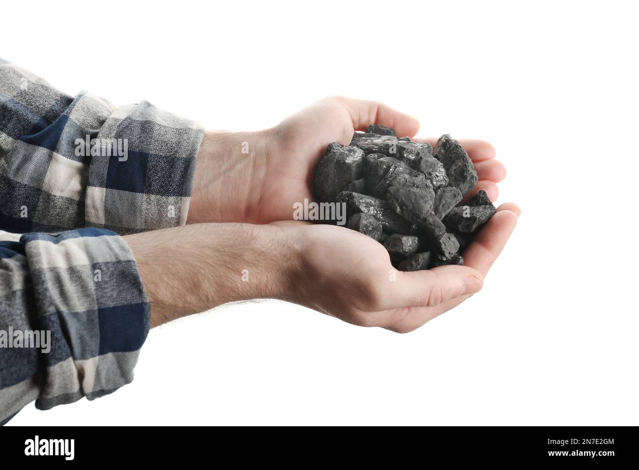 Man holding coal in hands on white background, closeup Stock Photo - Alamy