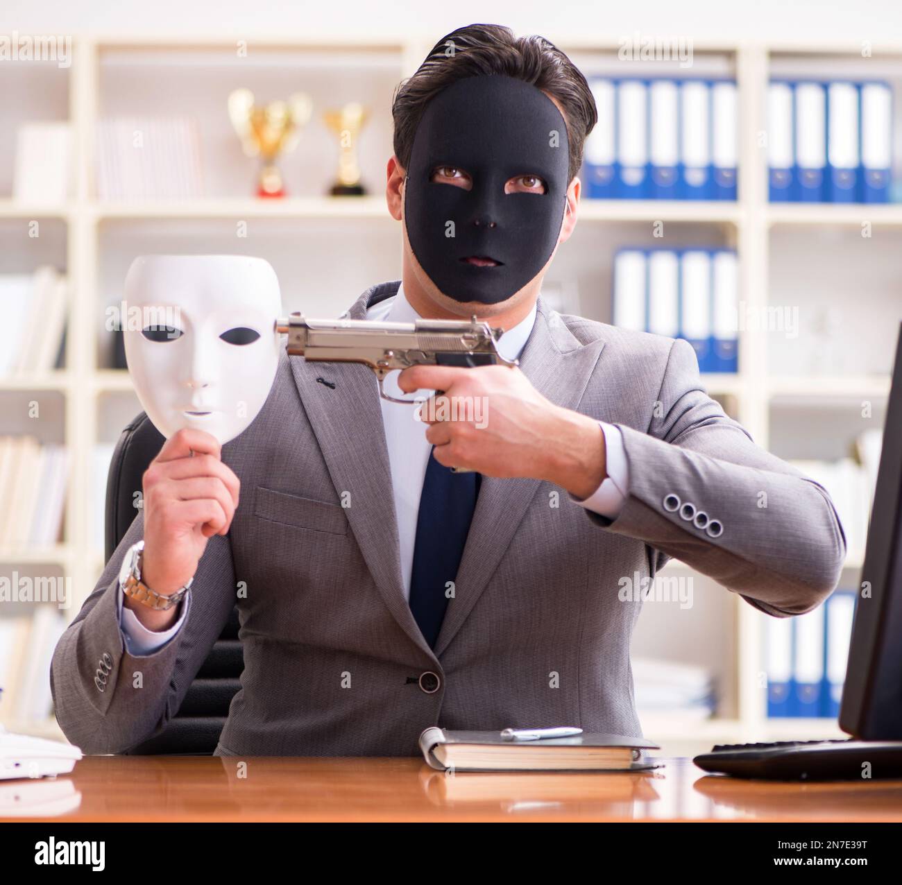 The businessman with mask in office hypocrisy concept Stock Photo - Alamy