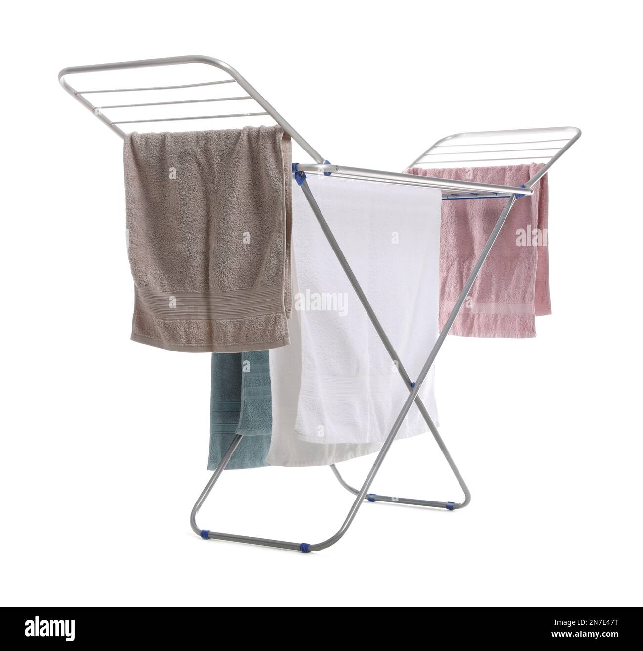 Modern drying rack with towels on white background Stock Photo - Alamy