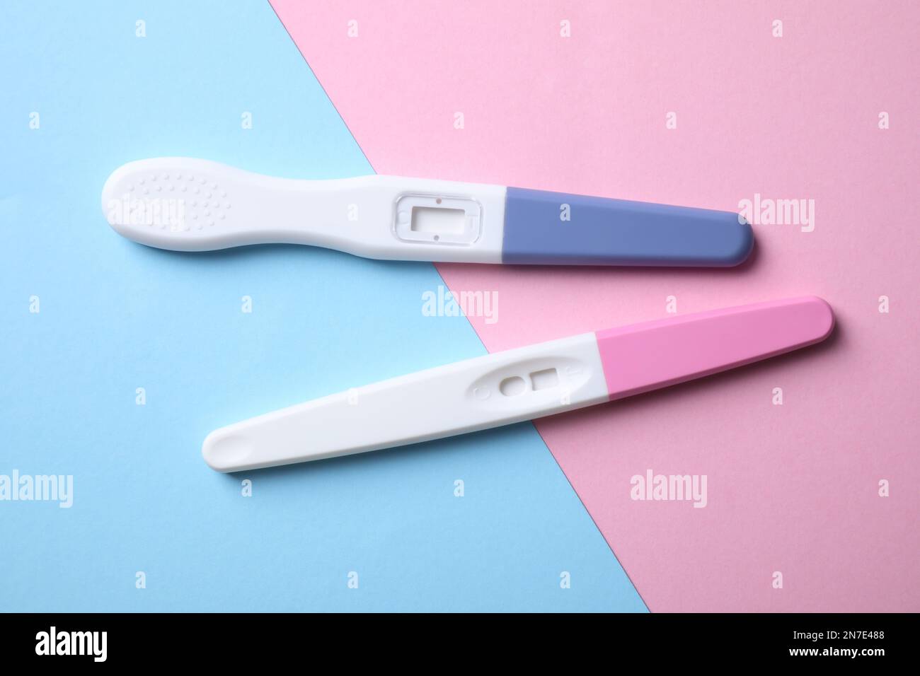 Different pregnancy tests on color background, flat lay Stock Photo - Alamy