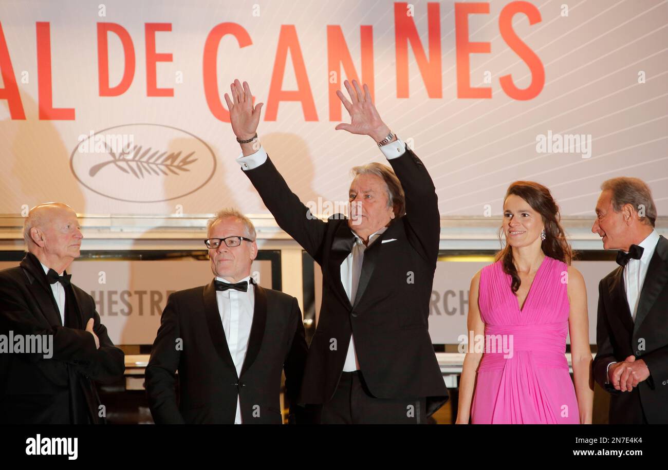 Actor Alain Delon, centre, waves as, from left, festival director ...