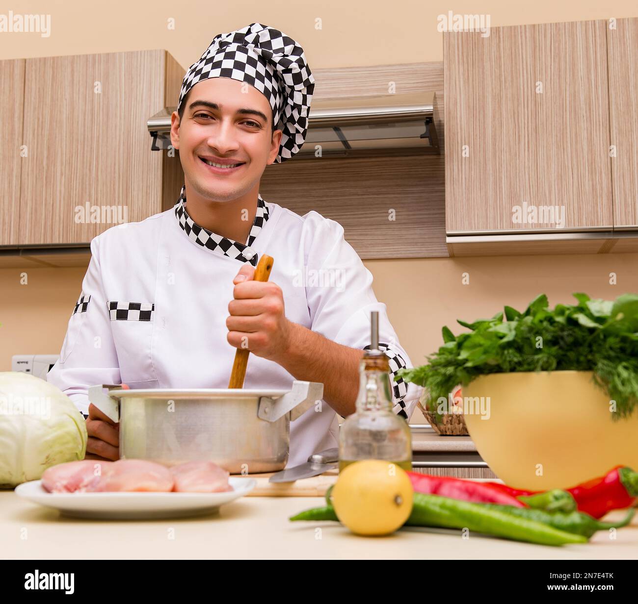 The young chef working in the kitchen Stock Photo - Alamy