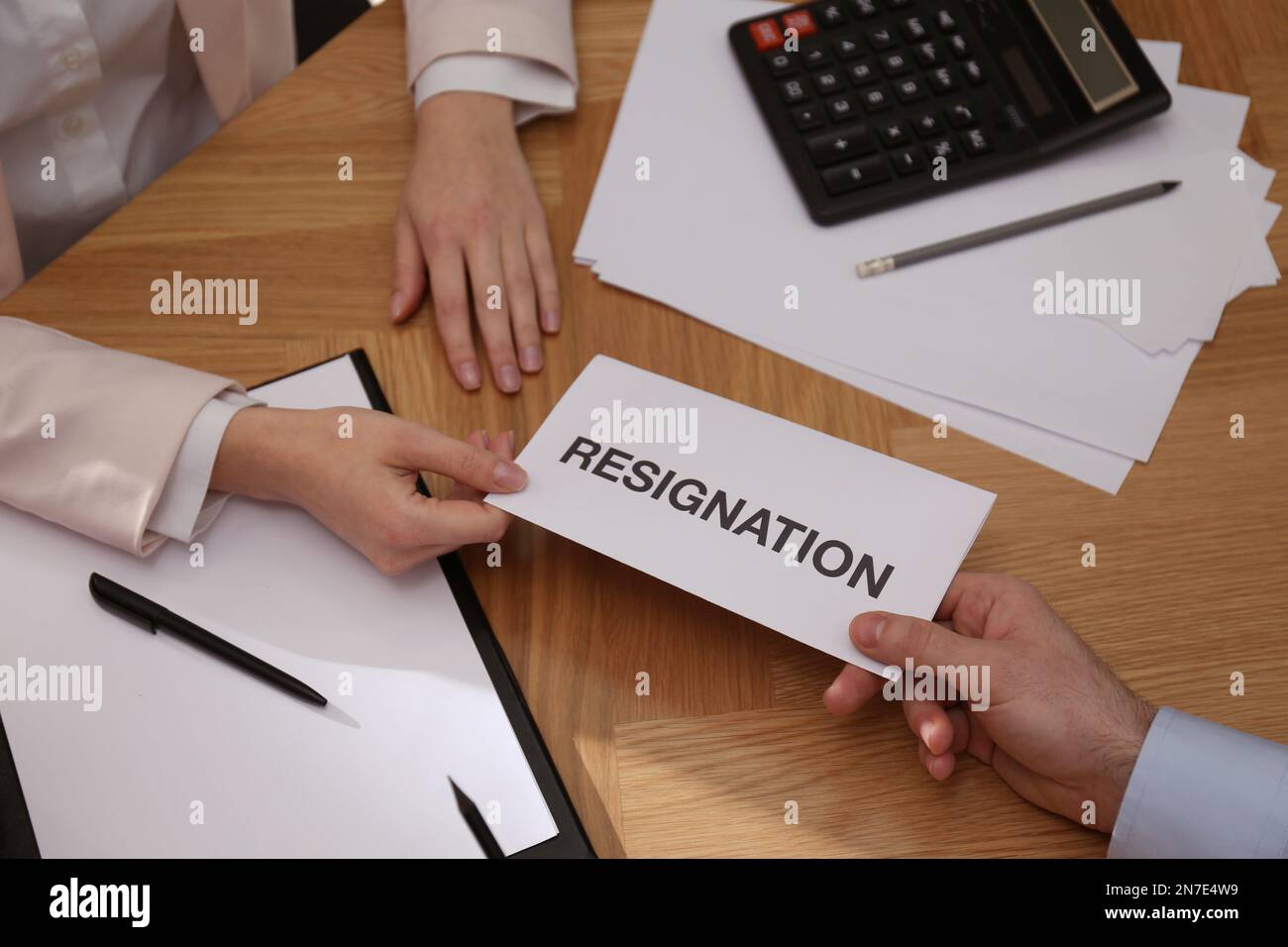 Employee giving resignation letter to boss in office, closeup Stock ...