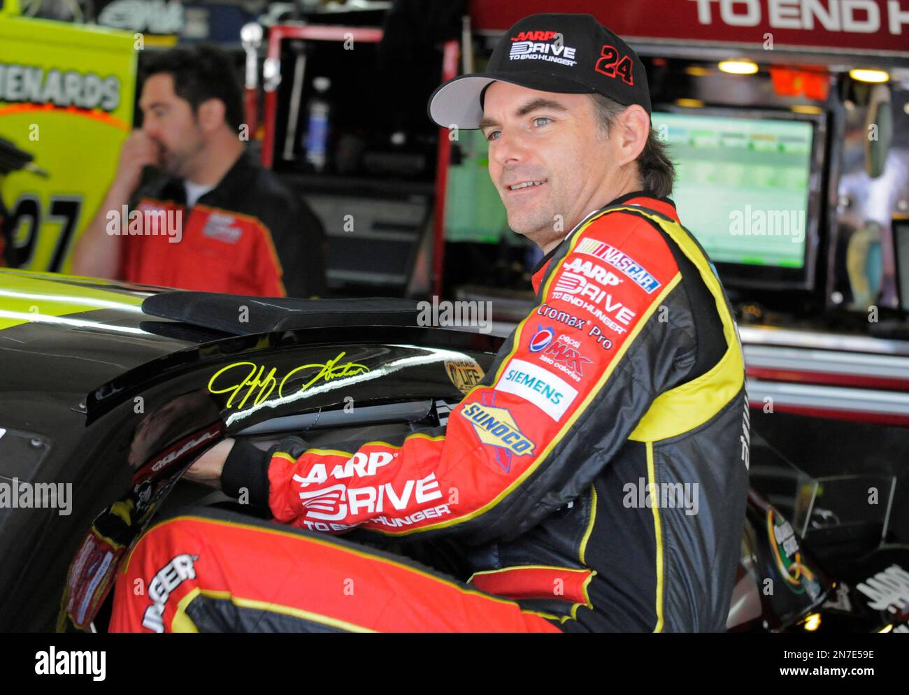Jeff Gordon climbs into his car before practice for Sunday's NASCAR ...