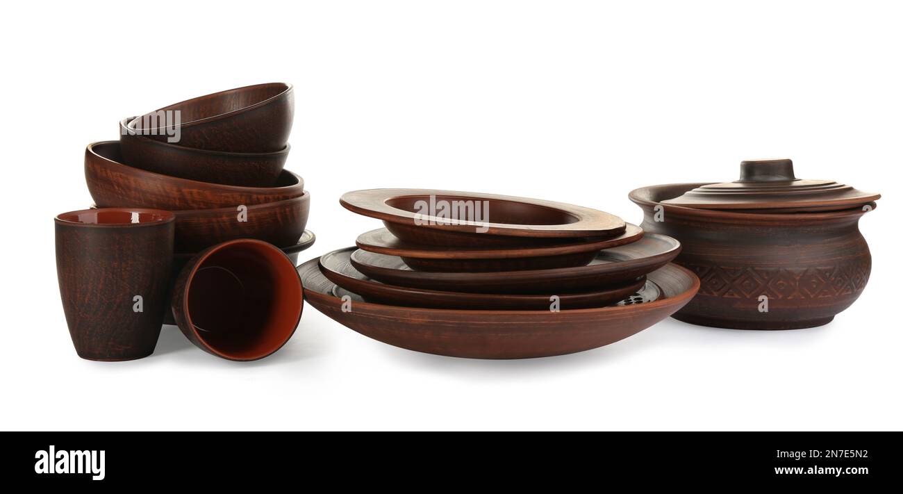 Set of stylish clay dishes on white background Stock Photo - Alamy
