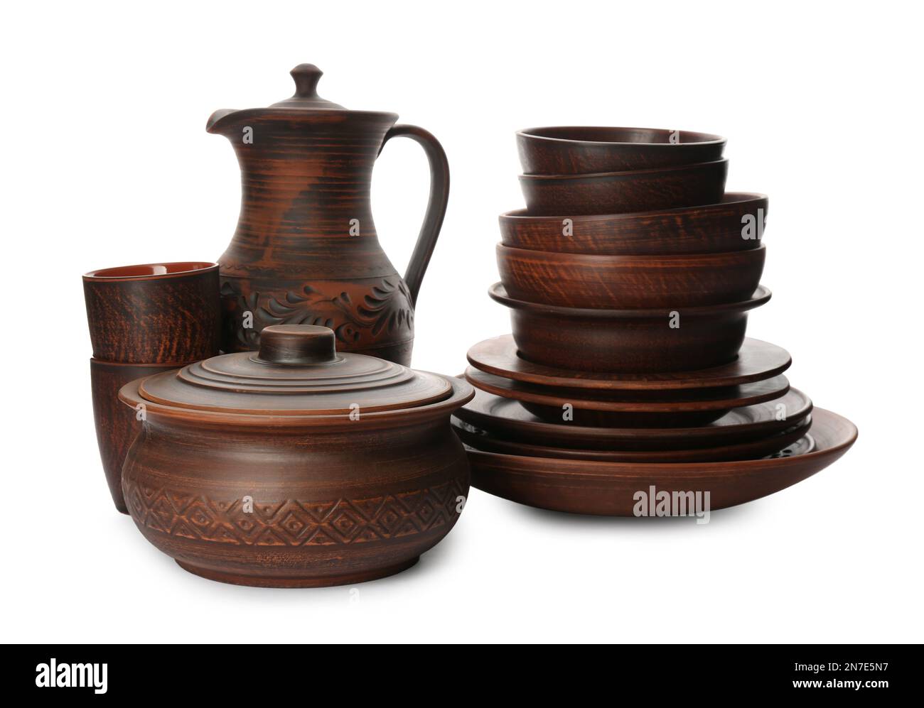 Set of stylish clay dishes on white background Stock Photo - Alamy
