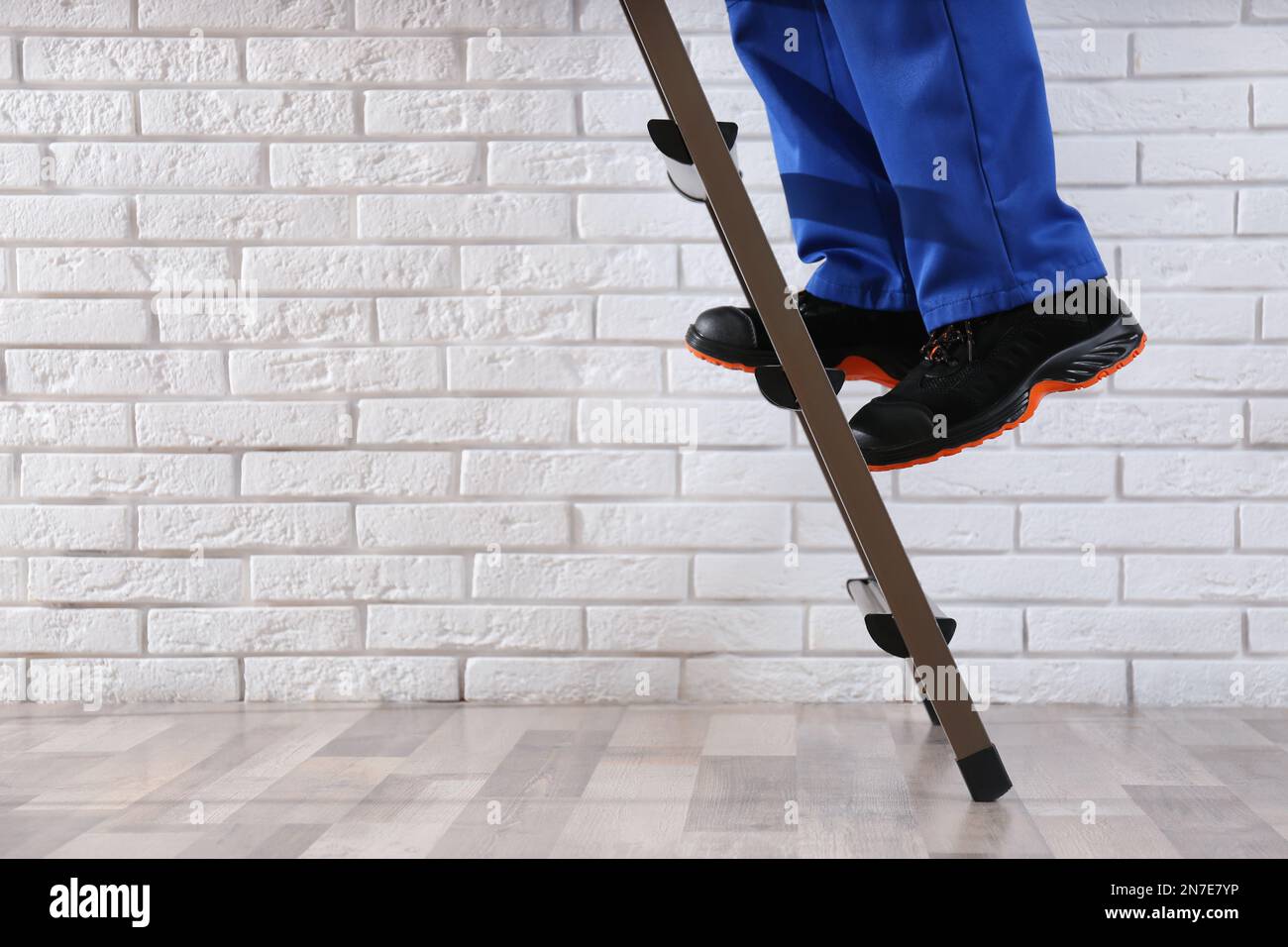 Office worker climbing up ladder hi-res stock photography and images ...