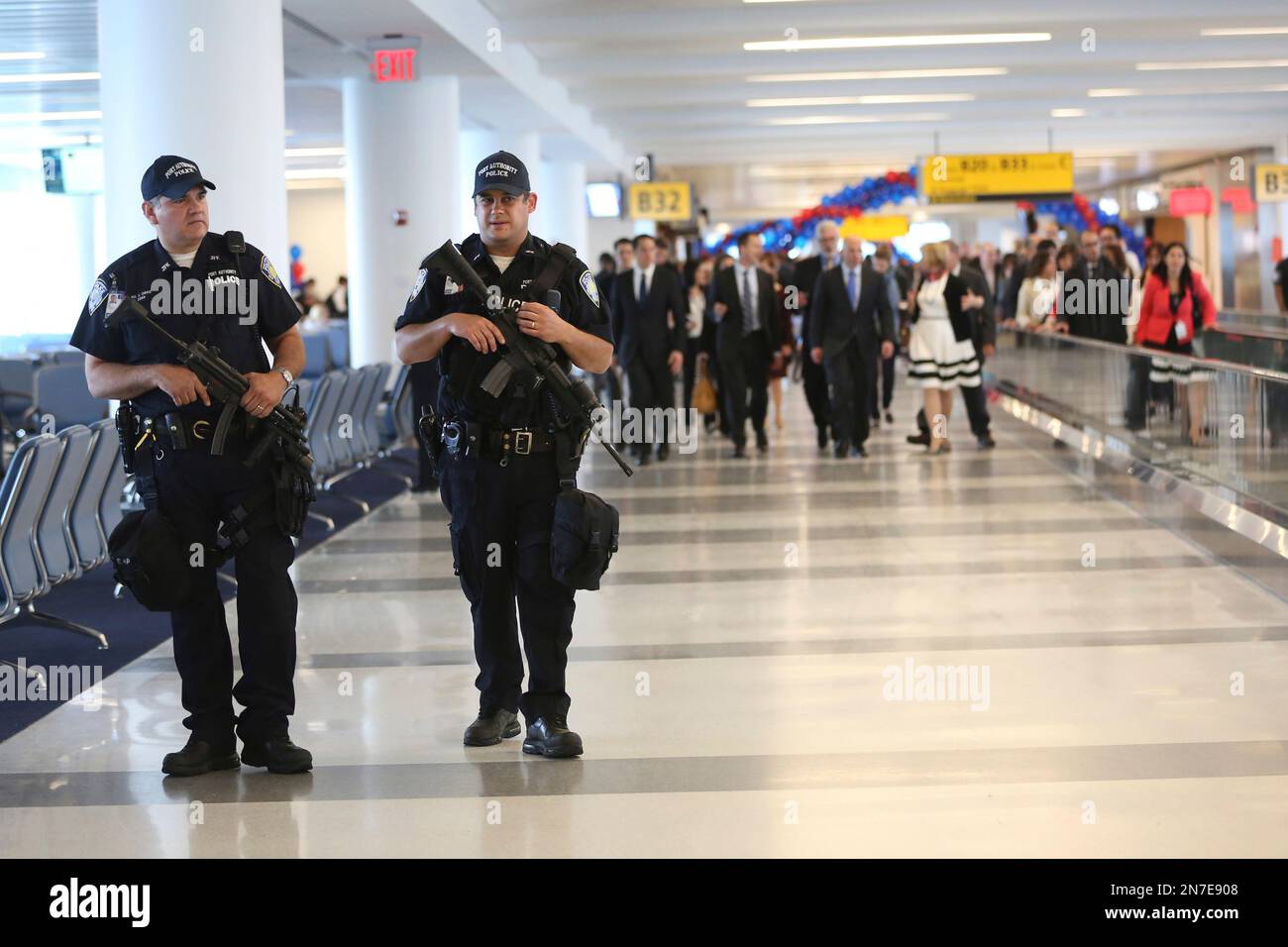 Heavily armed Port Authority police officers patrol the Delta airlines ...
