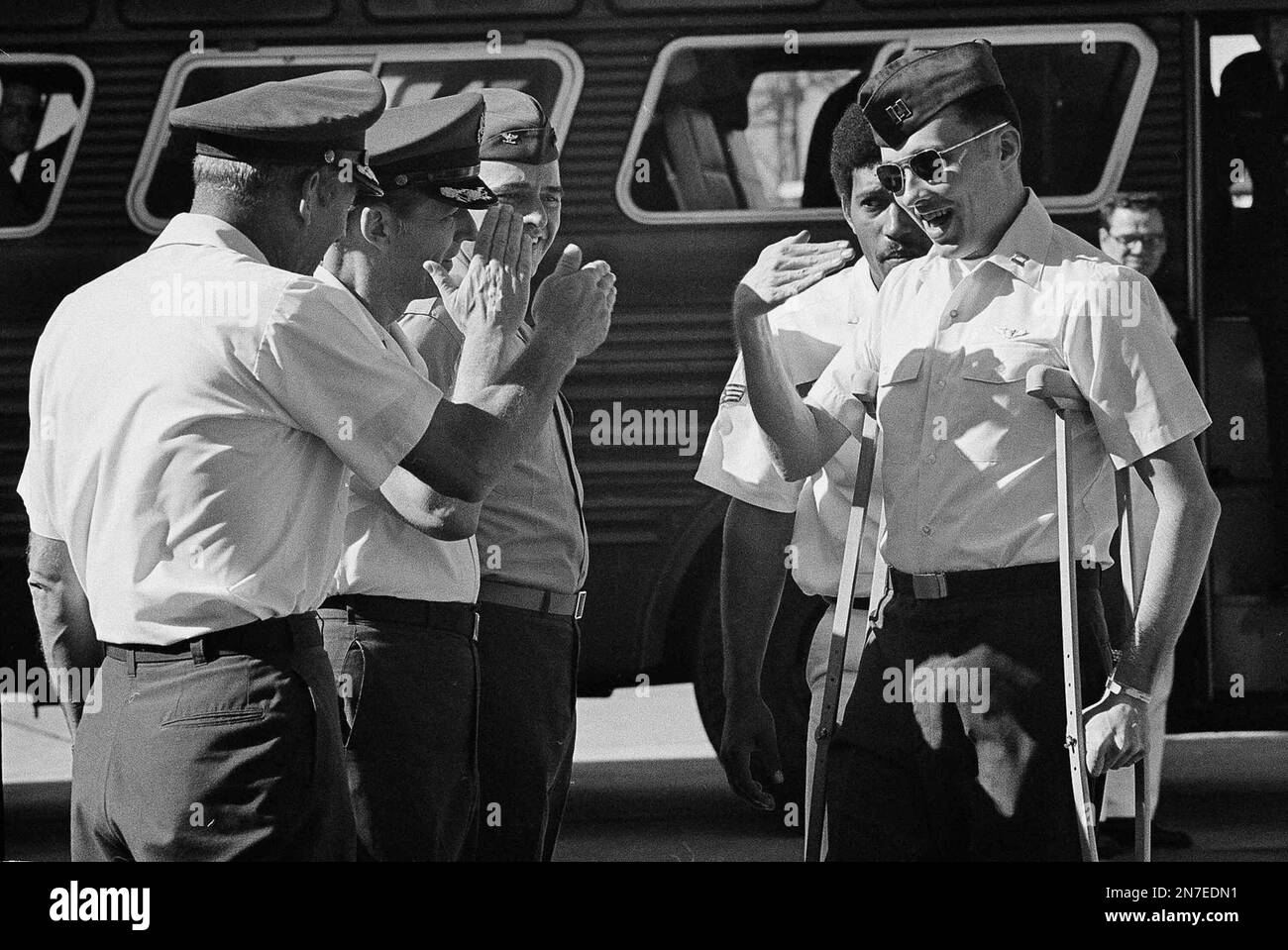 With a happy smile, Capt. David E. Baker of Westbury, N.Y., salutes the ...