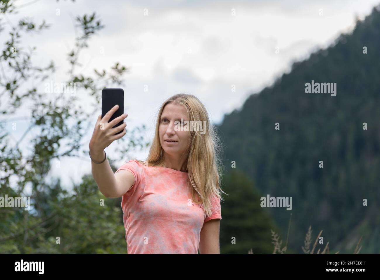 Beautiful Young Blonde Caucasian Woman Taking A Selfie With Smartphone