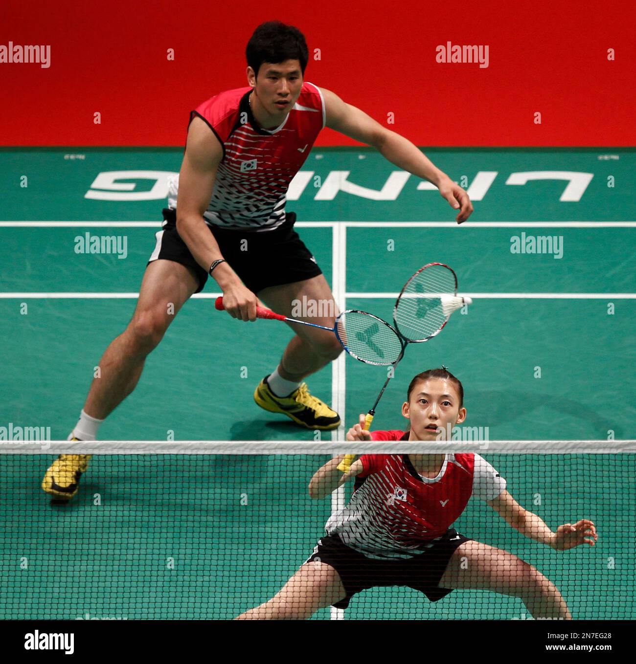 South Korea's Kim Ha-na, front, returns a shot against Germany's ...