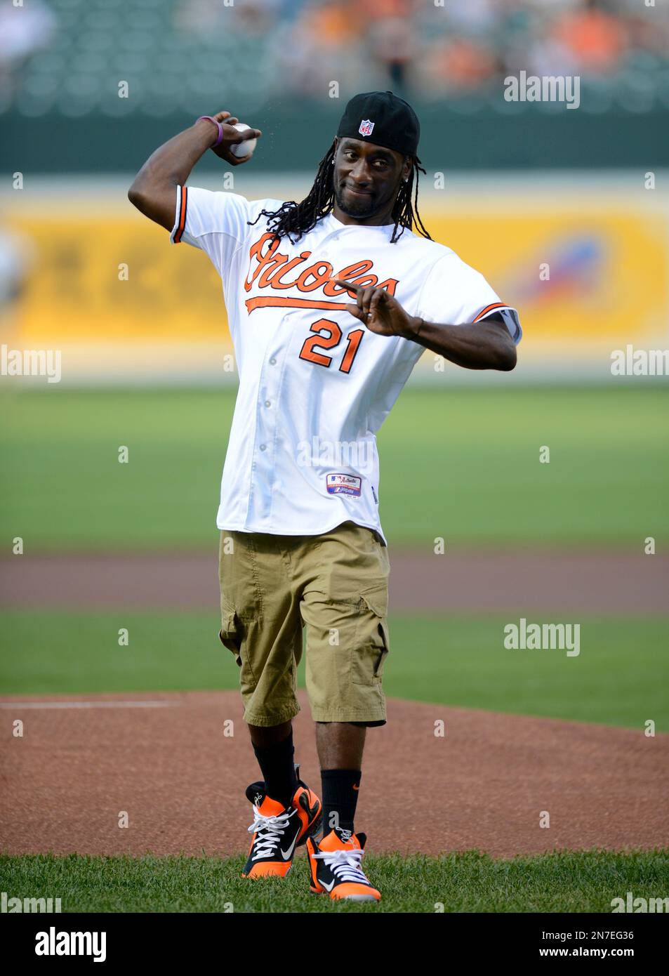 Baltimore Ravens' Lardarius Webb throws out the ceremonial first pitch ...