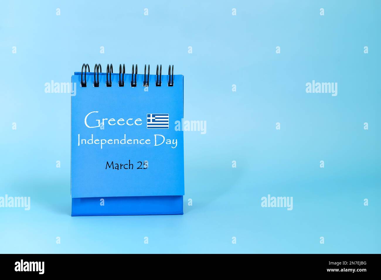 March 25 as Greece Independence Day date reminder on blue desk calendar ...
