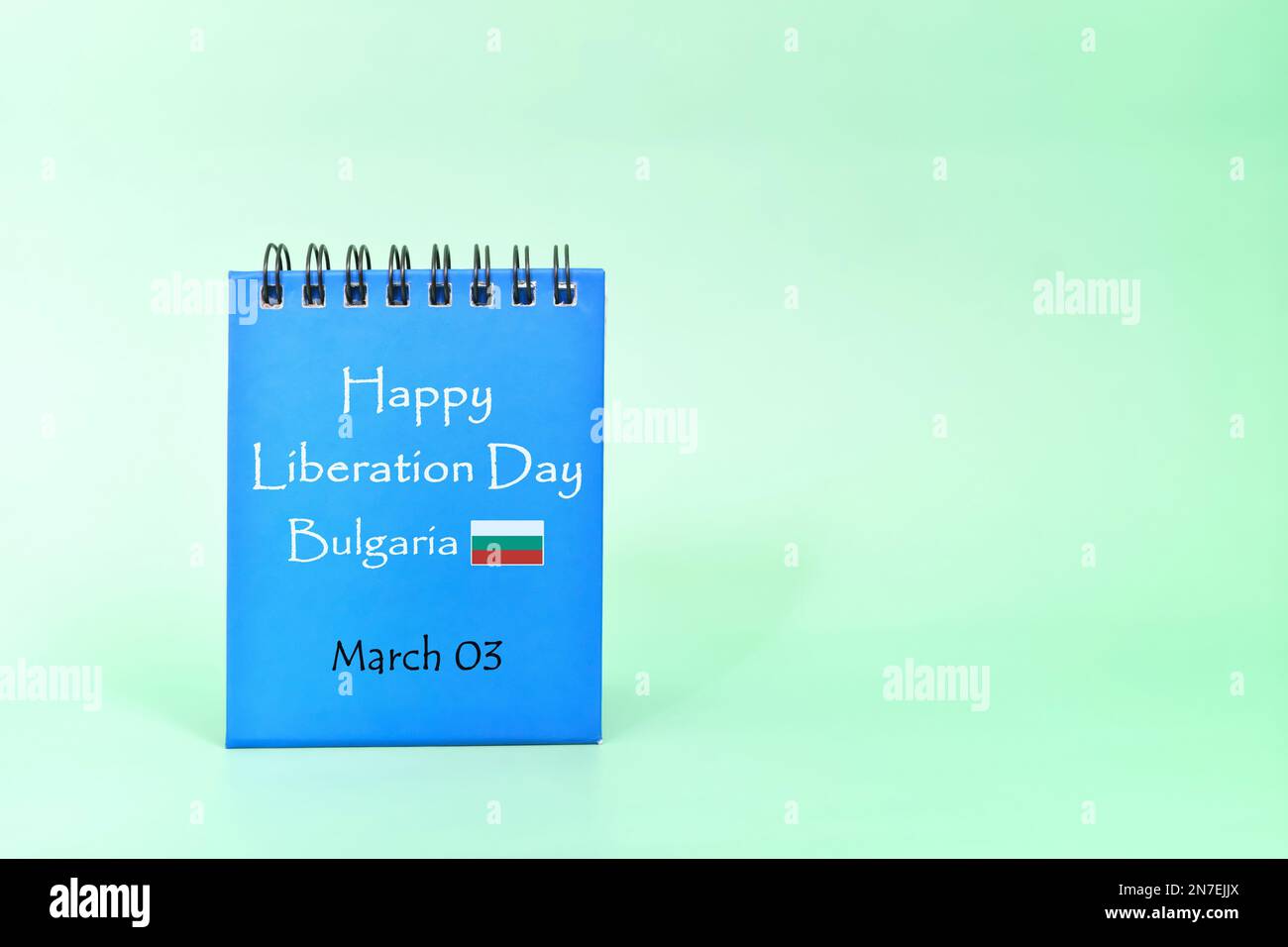 Happy Liberation Day Bulgaria greeting on blue desk calendar with flag ...