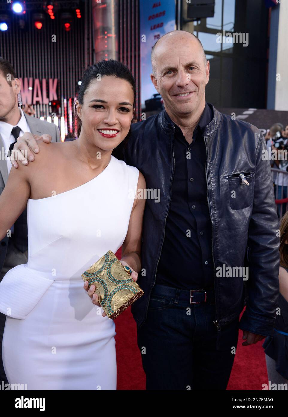 Actress Michelle Rodriguez, left, and producer Neil Moritz arrive at ...