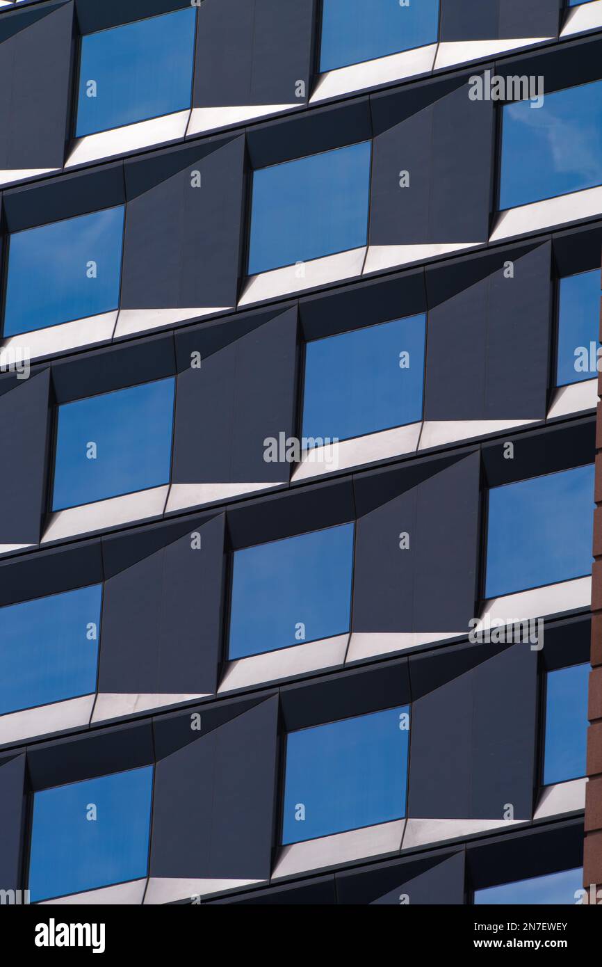 Apartment building exterior view with geometric patterns and modern glass windows, Melbourne ...