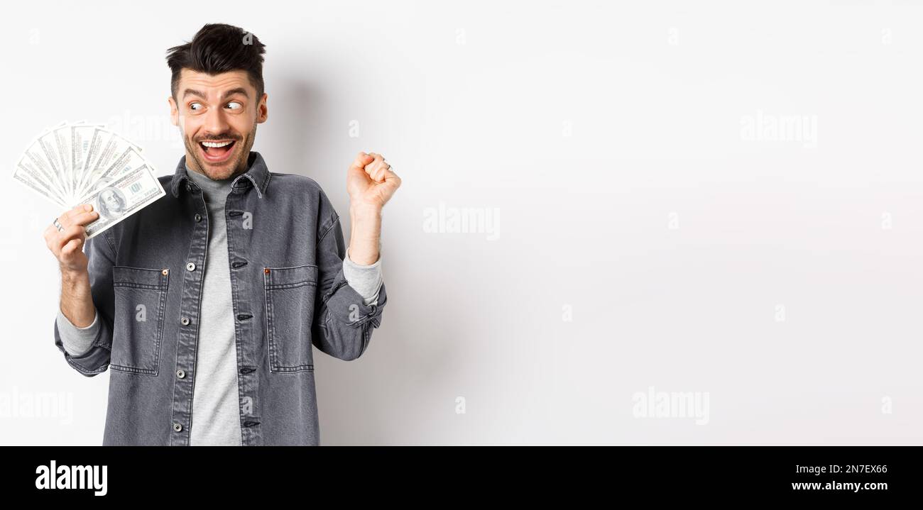 Lucky man winning prize money and scream of excitement, staring at ...