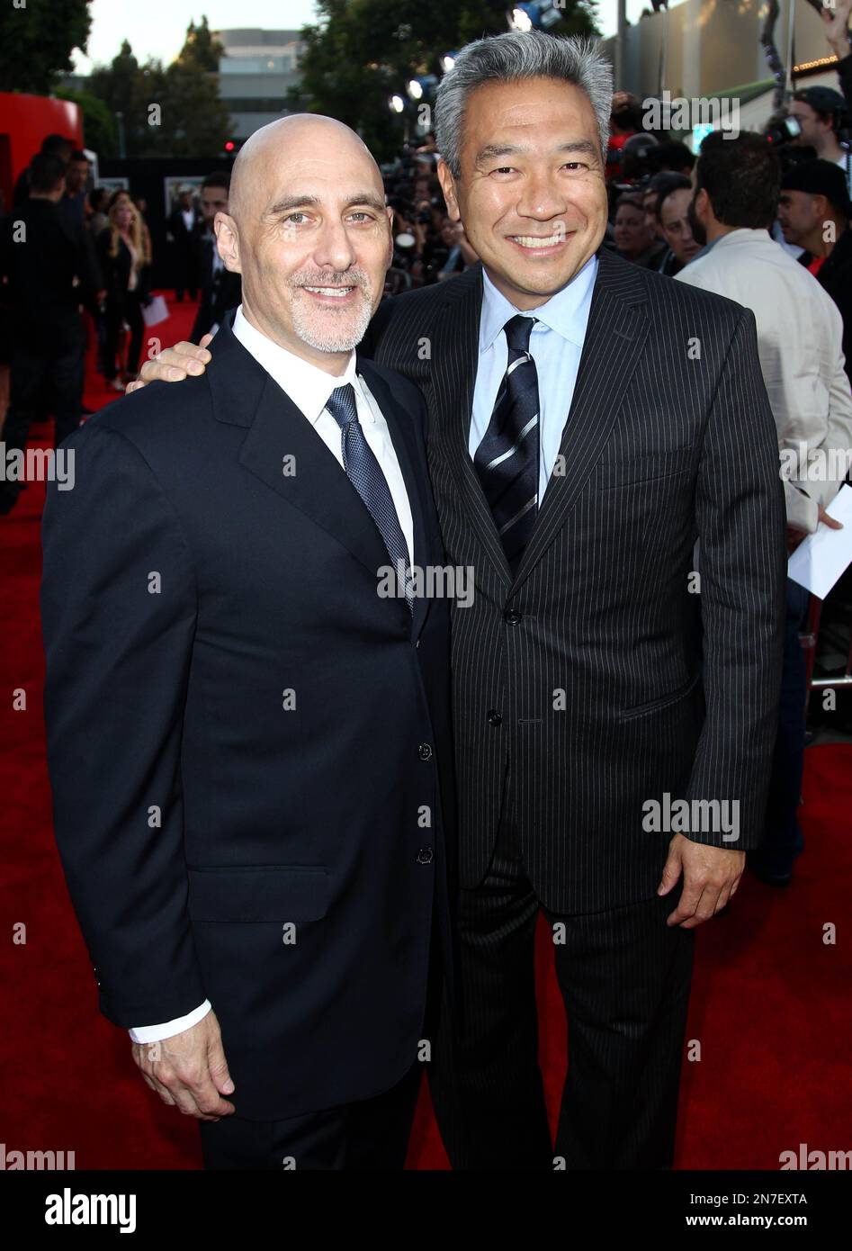 Kevin Tsujihara, right, and Jeff Robinov pose together at the LA ...