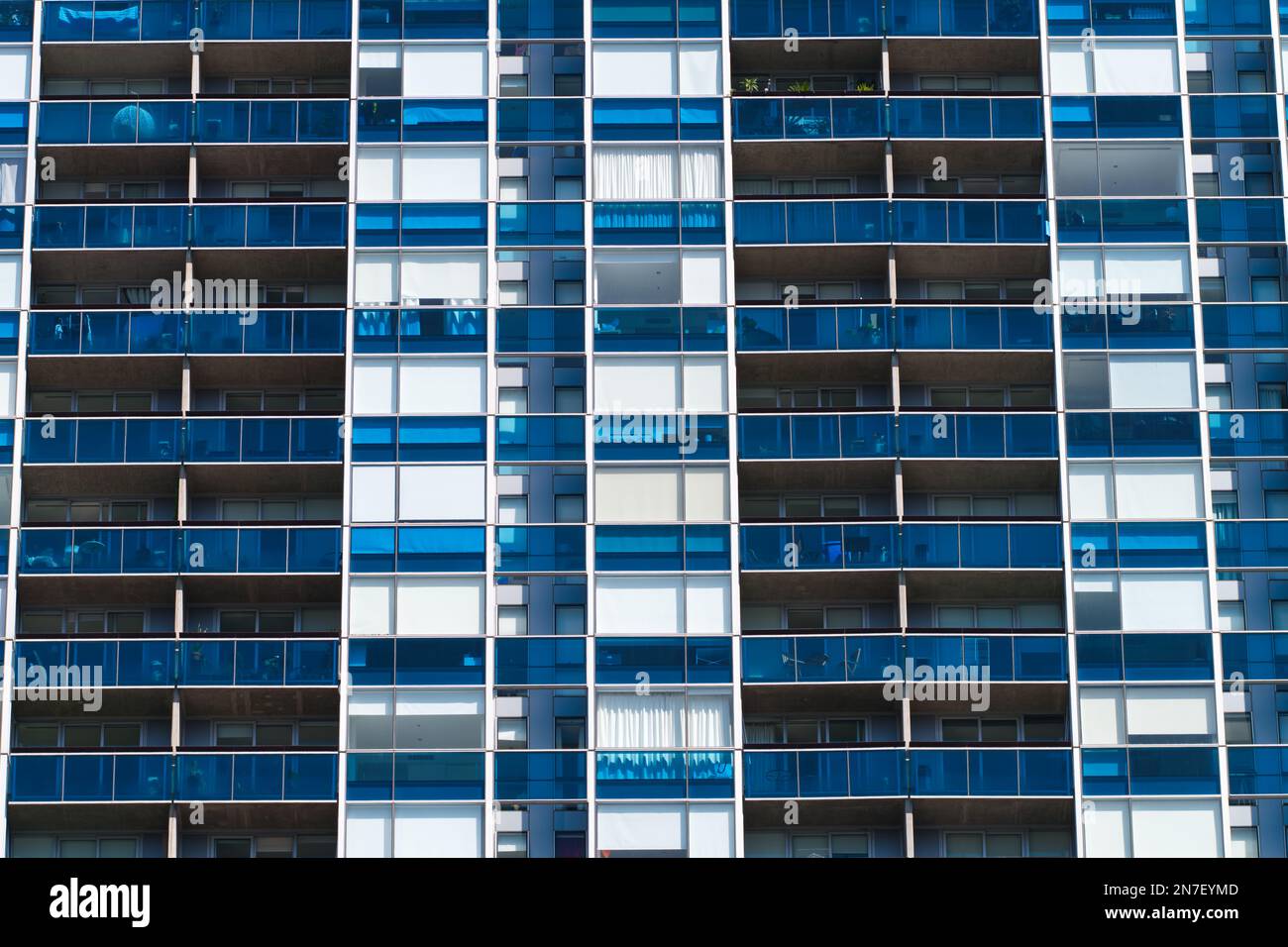 Modern city apartment block complex showing building exterior, glass ...