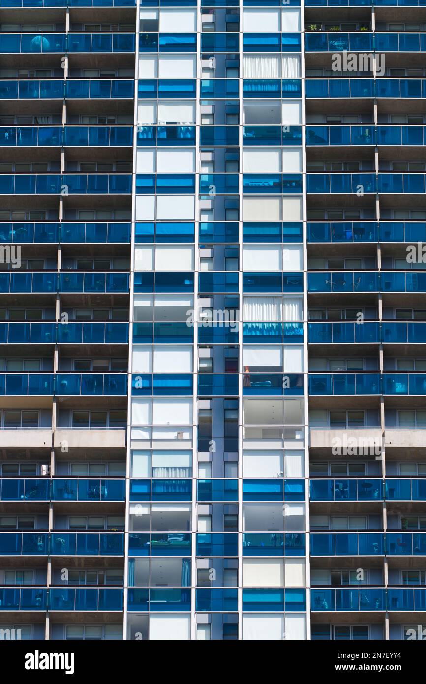 Modern city apartment block complex showing building exterior, glass ...