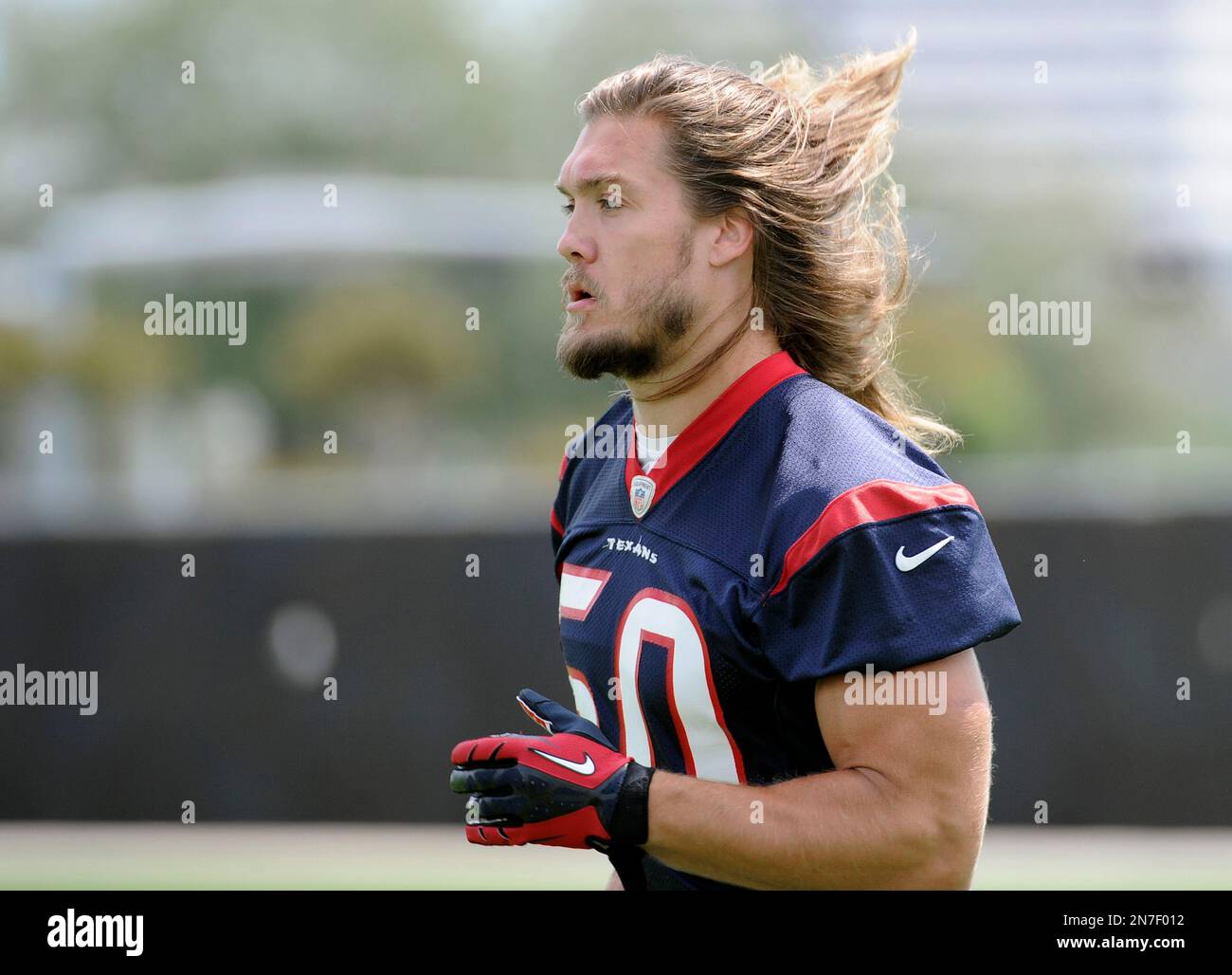 Houston Texans linebacker Bryan Braman runs to the practice fields for ...