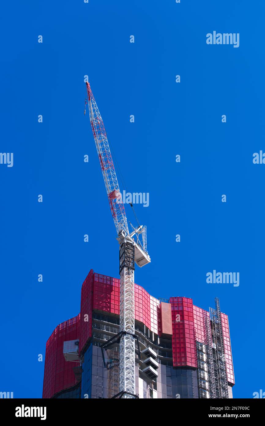 Construction crane on building site showing crane jib and construction ...