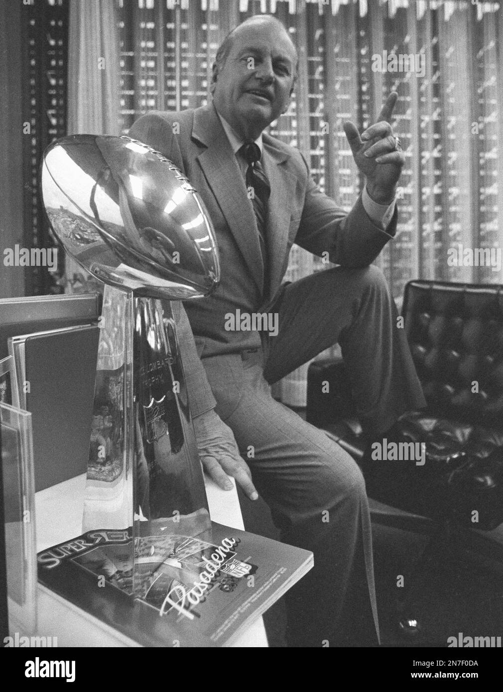 Tex Schramm, president of the Dallas Cowboys of the NFL, in front of ...