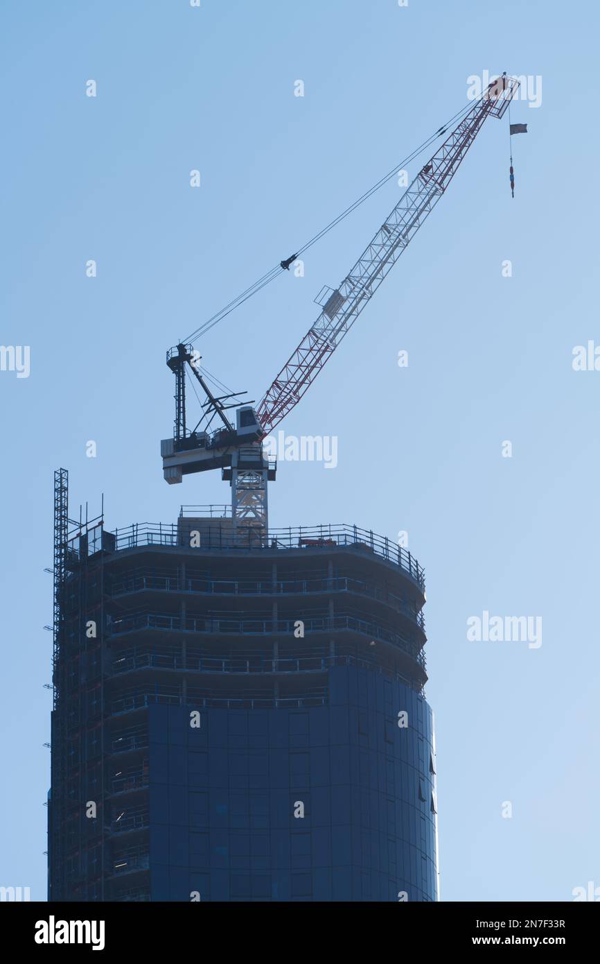 Skyscraper construction crane on building site, Melbourne city ...