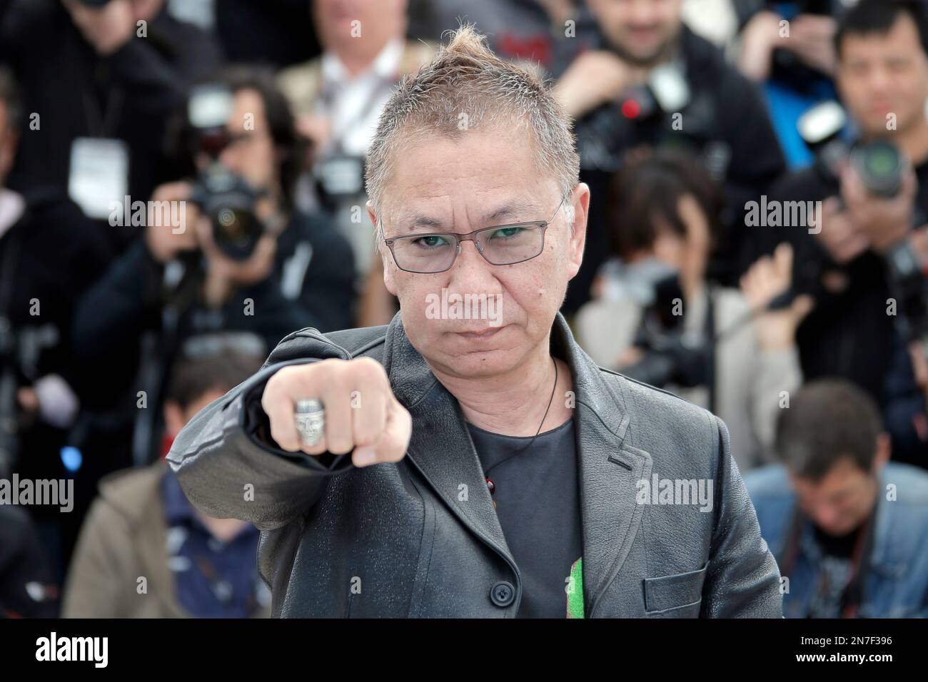 Director Takashi Miike poses for photographers during a photo call for ...