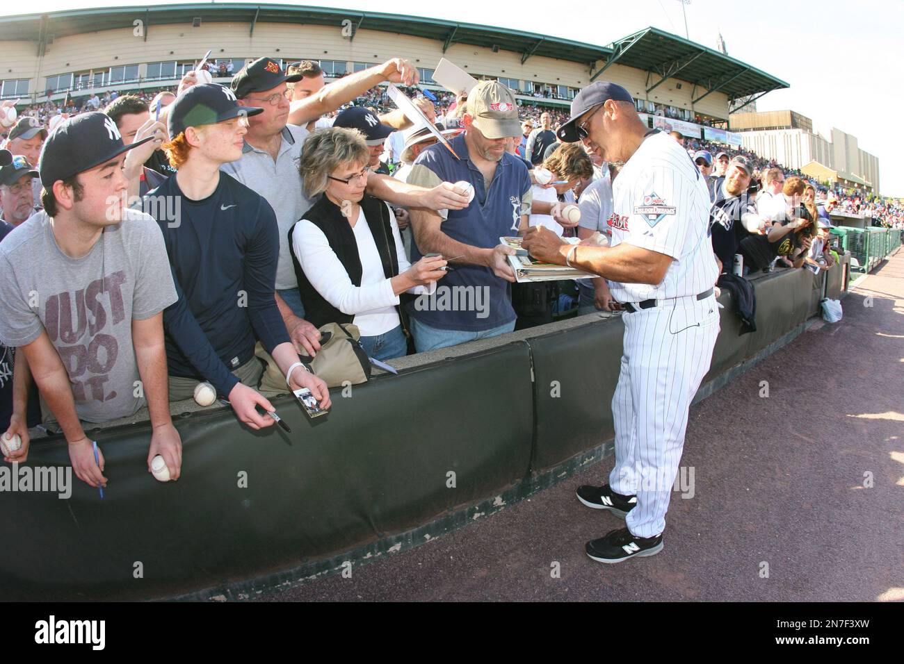 Reggie Jackson signs autographs at the 2013 Pepsi MAX Field of Dreams ...